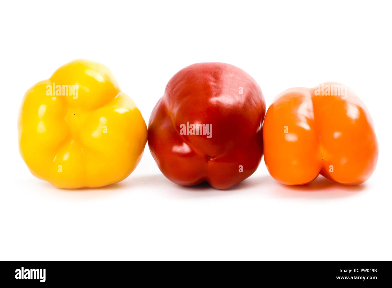 three bell peppers isolated on white background Stock Photo - Alamy