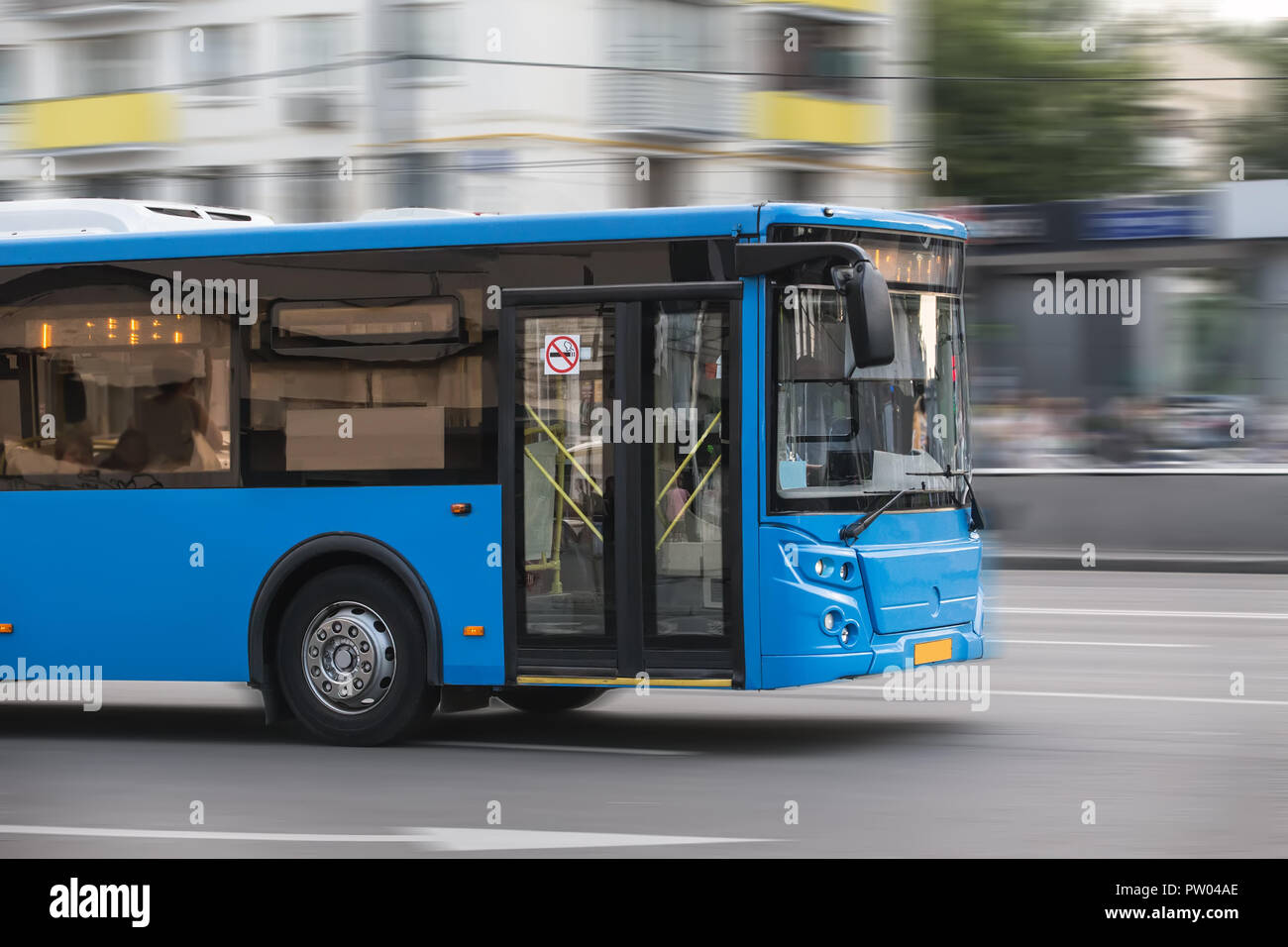 city bus goes along street Stock Photo - Alamy