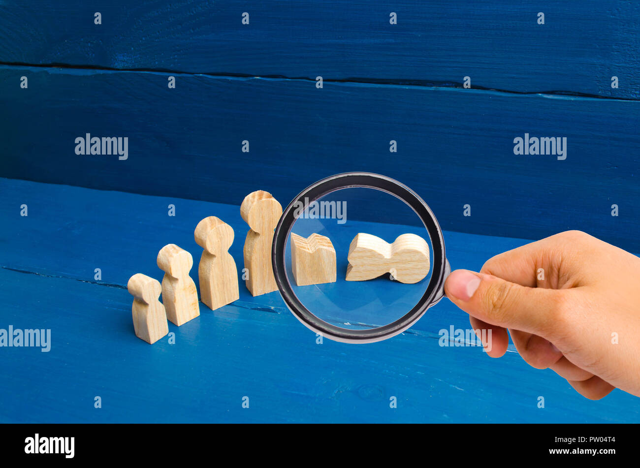Magnifying glass is looking at the People of different ages and a ...