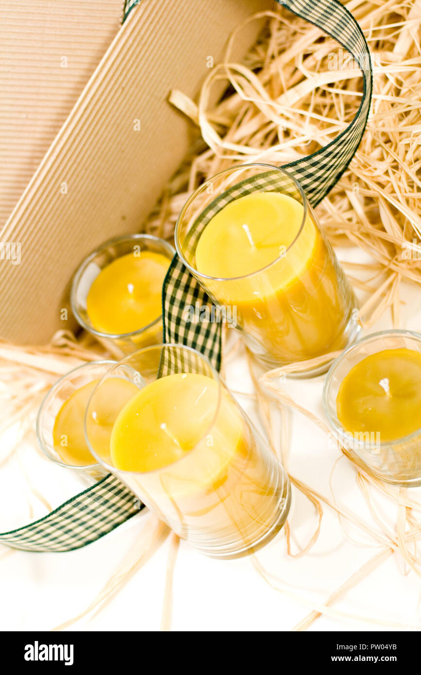 five yellow candles, ribbon and box closeup Stock Photo - Alamy