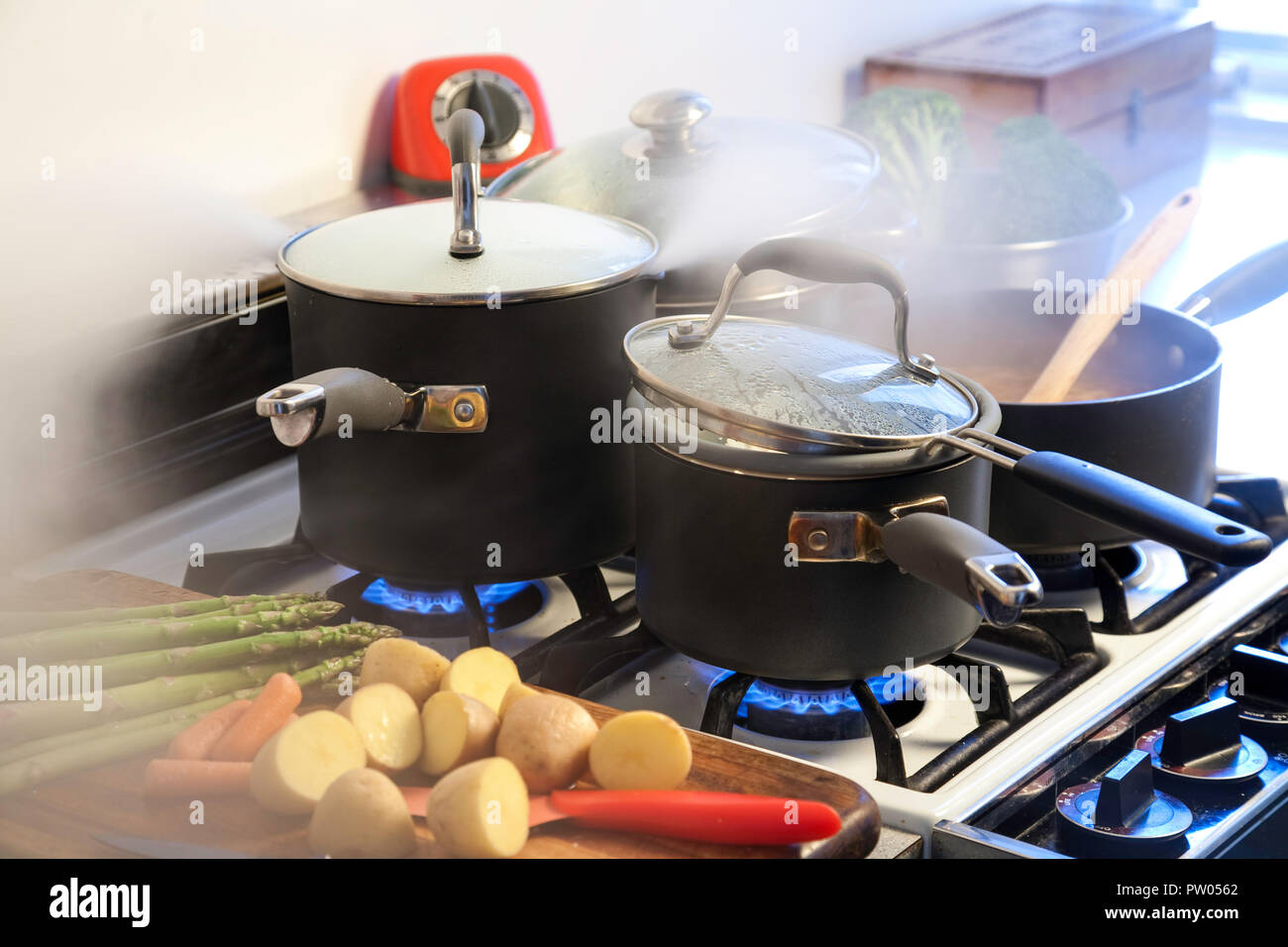 Steaming Pots on Residential Stovetop Stock Photo - Alamy
