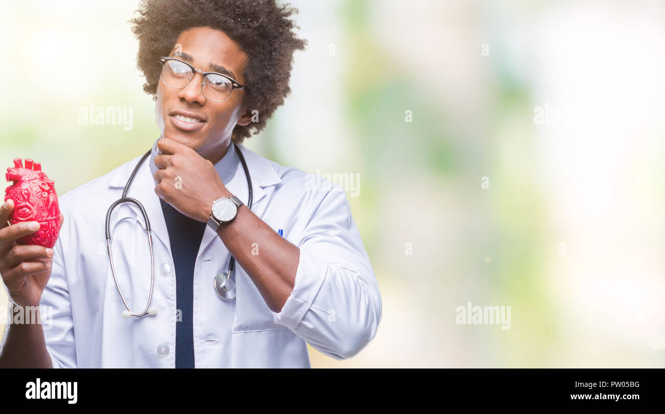 Afro american cardiologist doctor man over isolated background serious ...