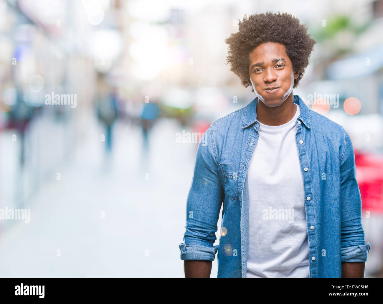 Afro american man over isolated background puffing cheeks with funny ...