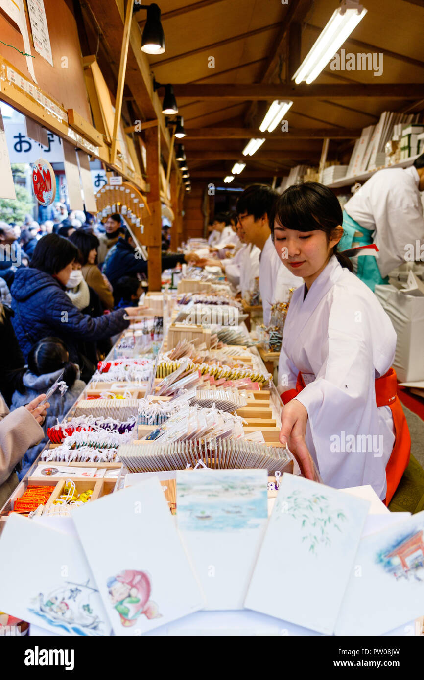 Japanese new year, shogatsu. Shrine Maidens, Miko, at office counter ...