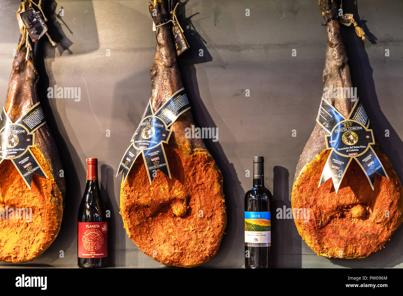 BOLOGNA, ITALY - OCTOBER 2, 2018: lights are enlightening hanging hams ...