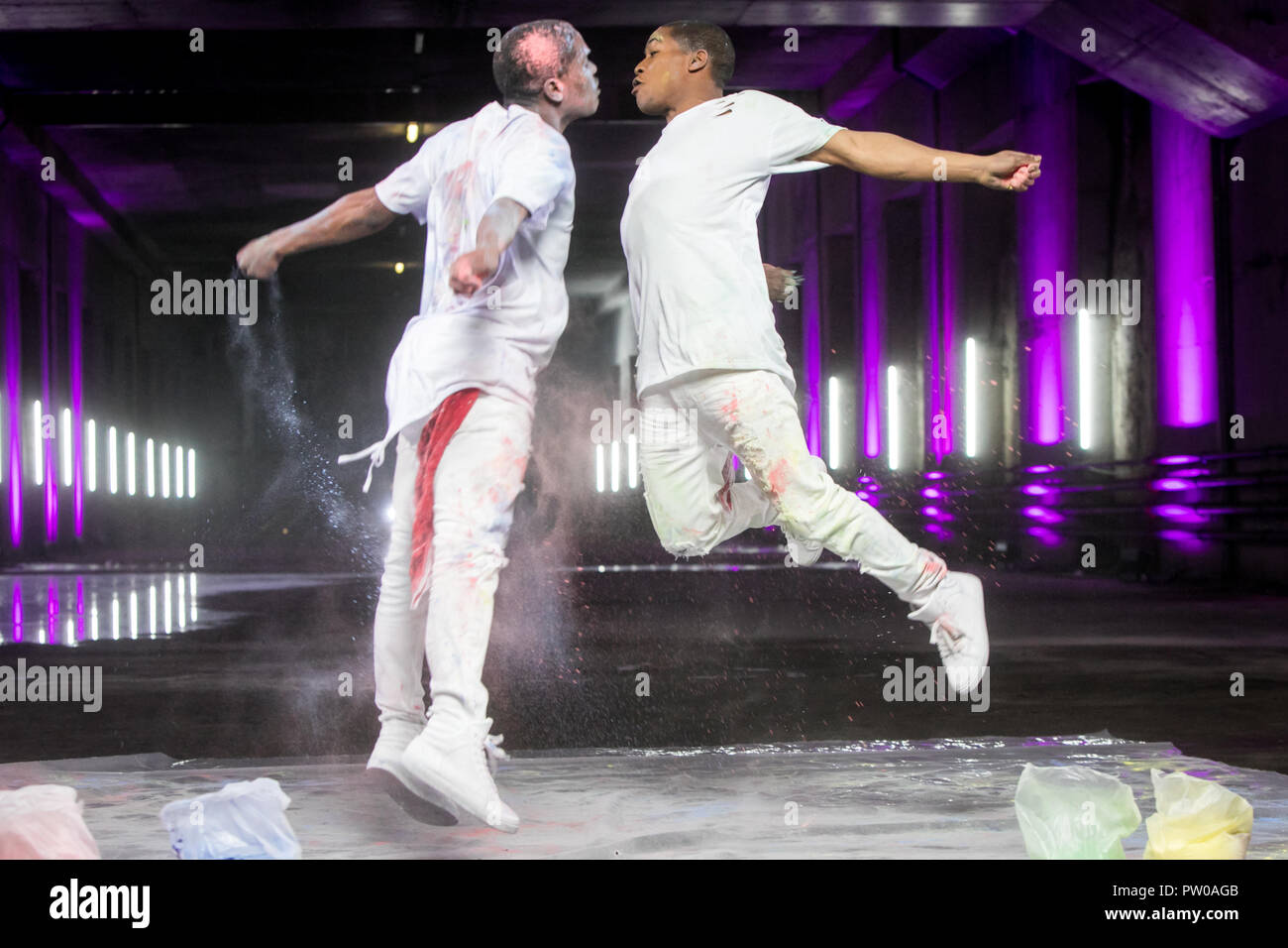 Dancers jumping in the air into each other Stock Photo - Alamy