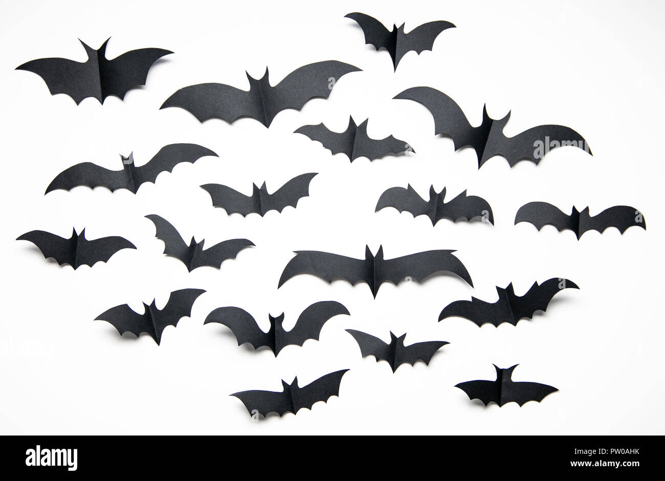 Halloween paper bat decorations on a white background Stock Photo - Alamy