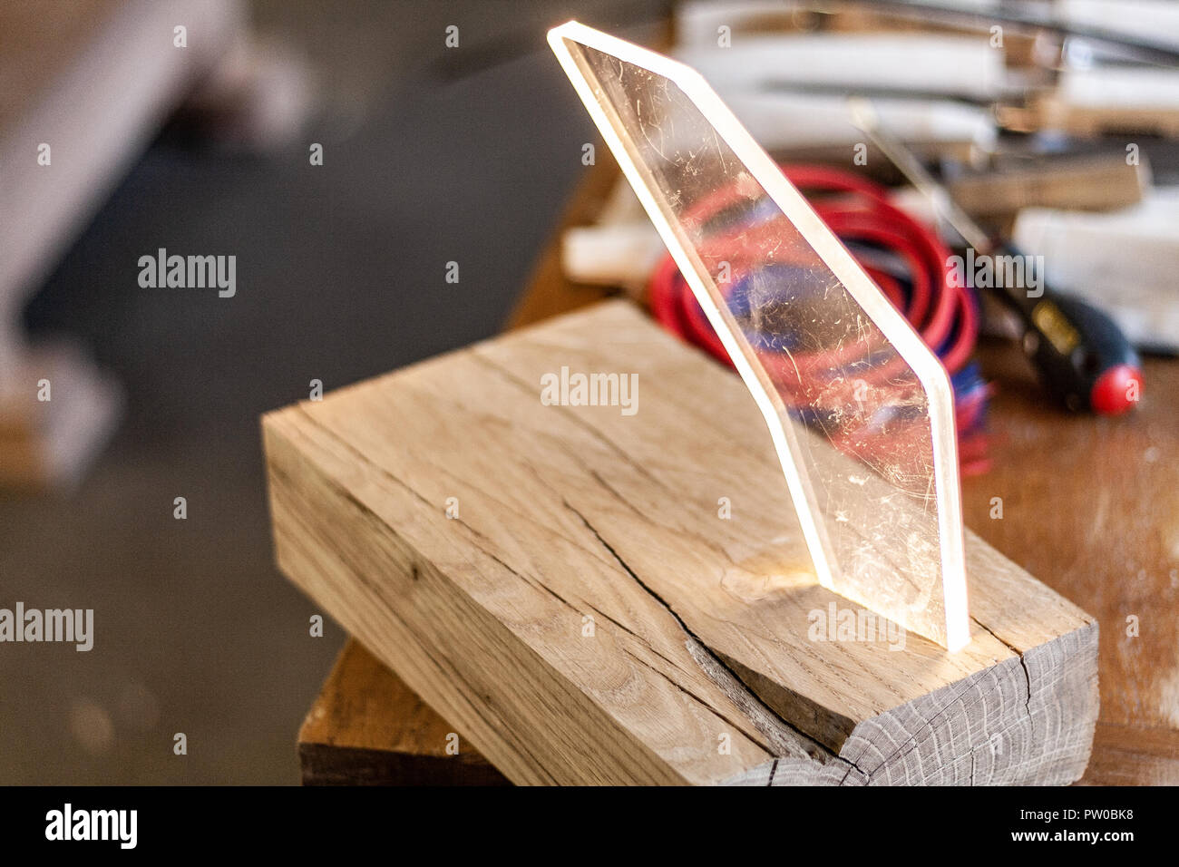 Glowing white shard, wood and glass lamp. Eco-friendly woodworker's ...
