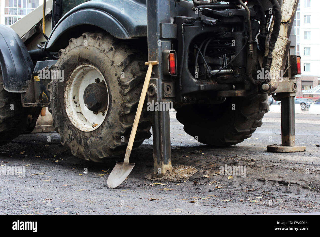 Tractor strong outrigger stabilizing legs extended to stabilize and ...