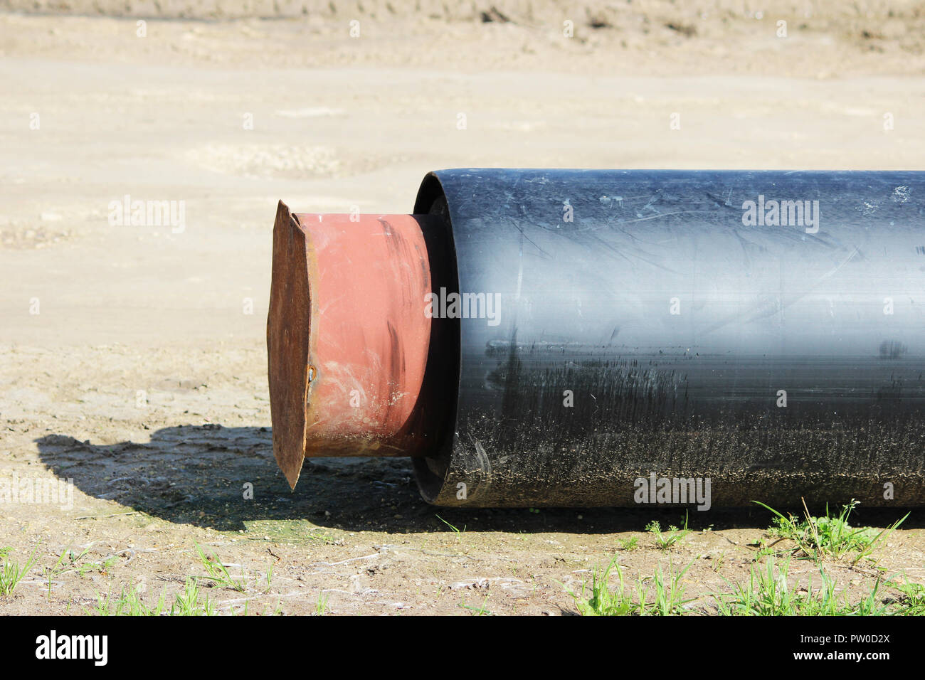 A modern large-diameter water pipe with insulation to save heat ...
