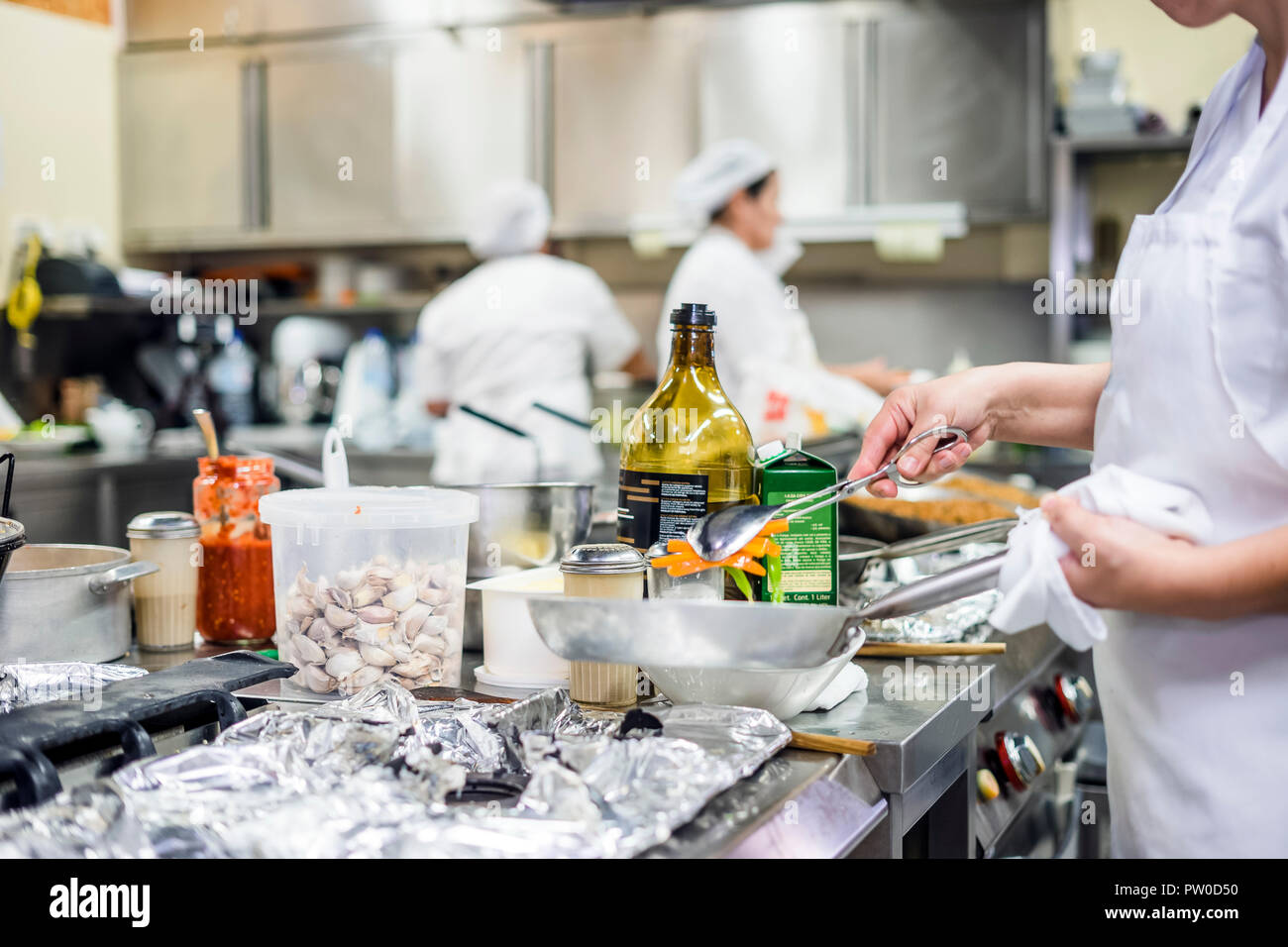 Kitchen staff busy with preparing vegetables during lunch time Stock ...