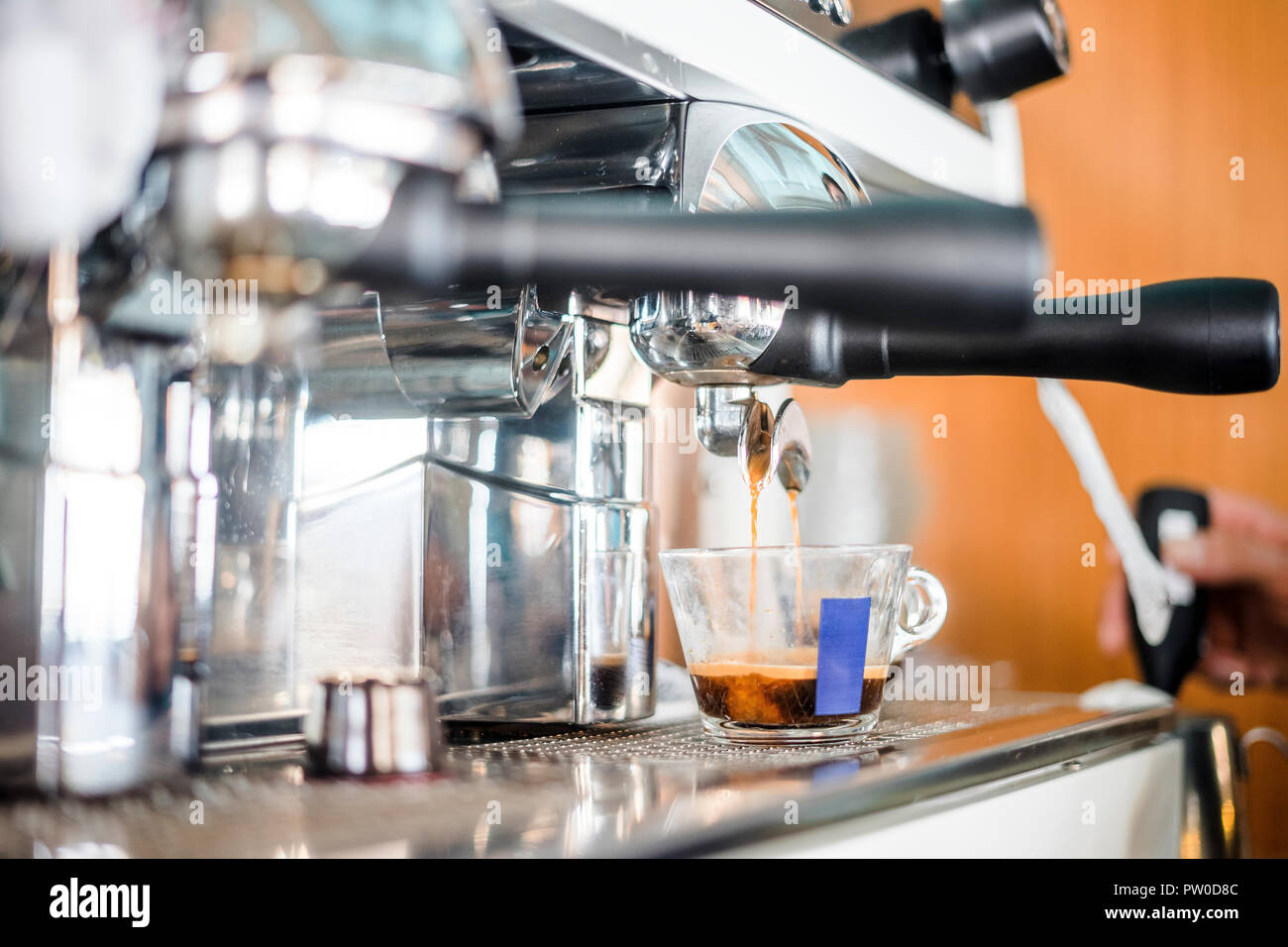 Preparing delicious coffee from coffee machine in the restaurant Stock ...