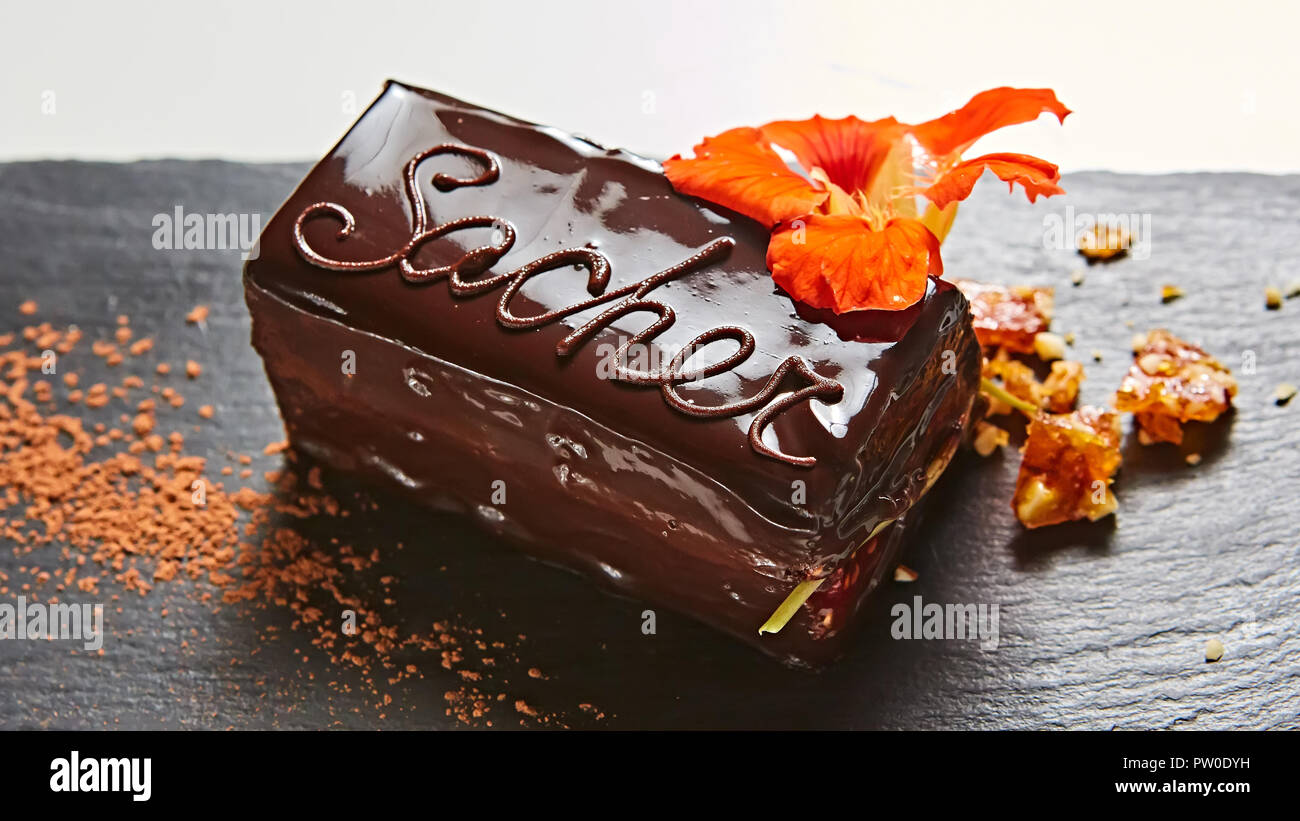 A piece of Sacher cake. Shallow dof Stock Photo - Alamy