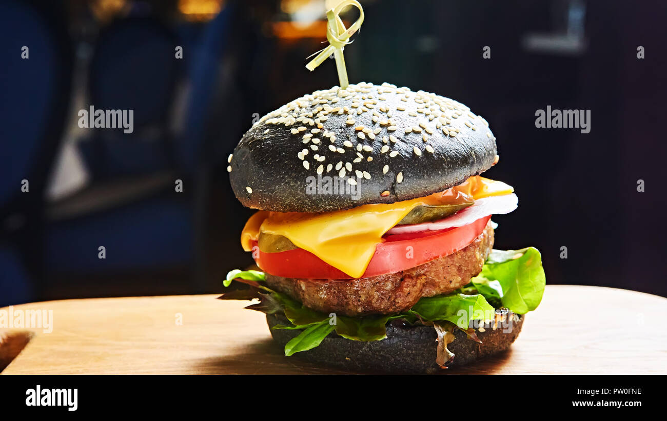 Japanese Black Burger with Cheese. Cheeseburger from Japan with black ...