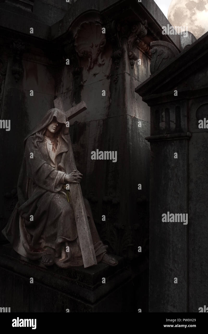 Lady death statue from an old european cemetery in a full moon night ...