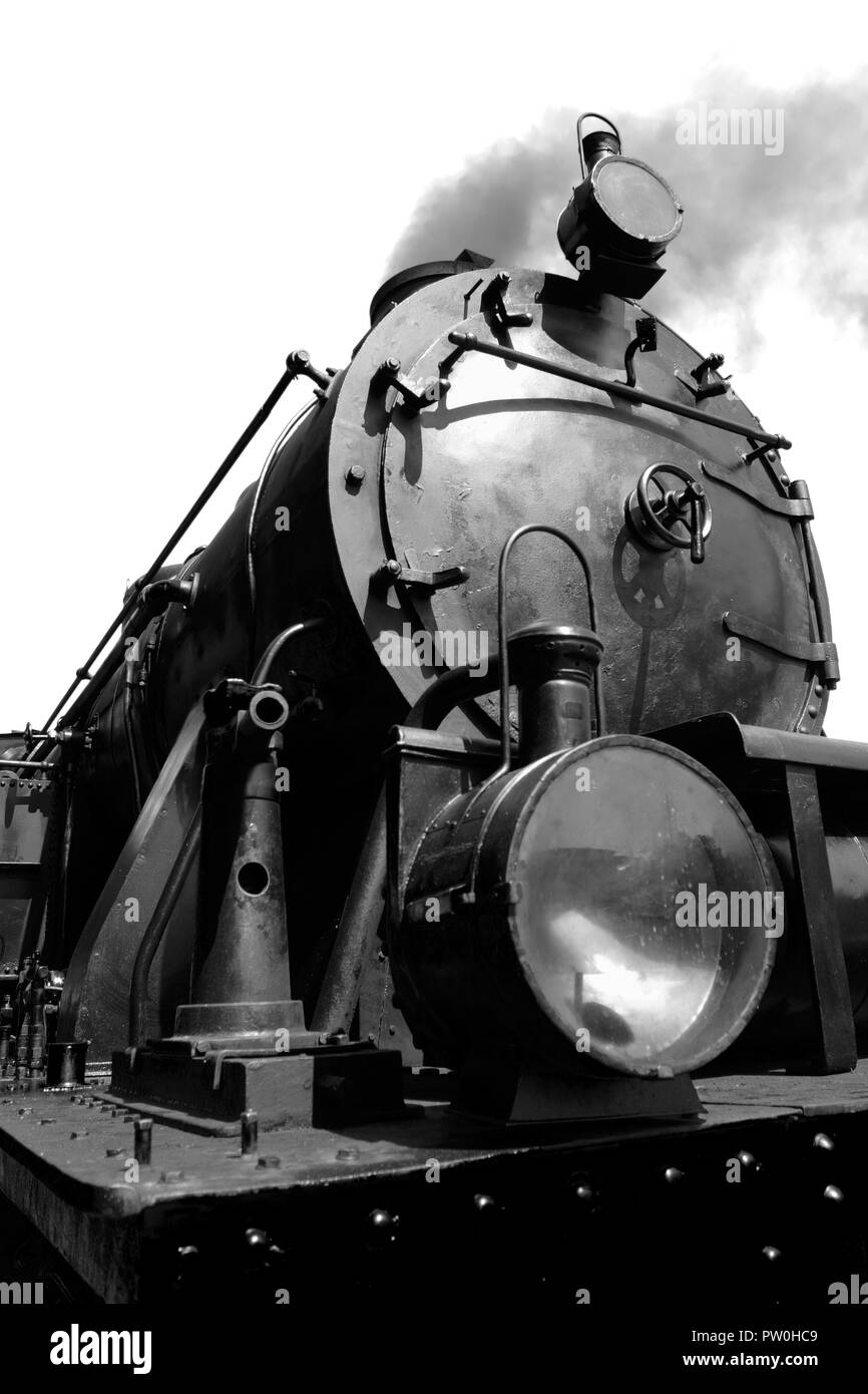 Detail of Vintage steam engine, working, with smoke - converted to ...