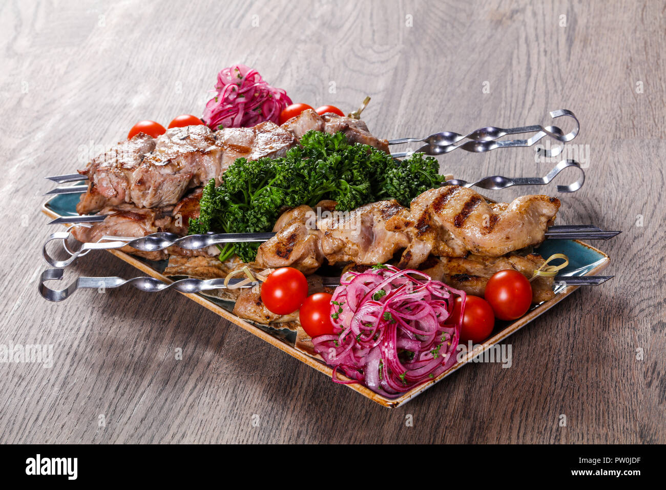 Grilled chicken and pork barbeque Stock Photo - Alamy