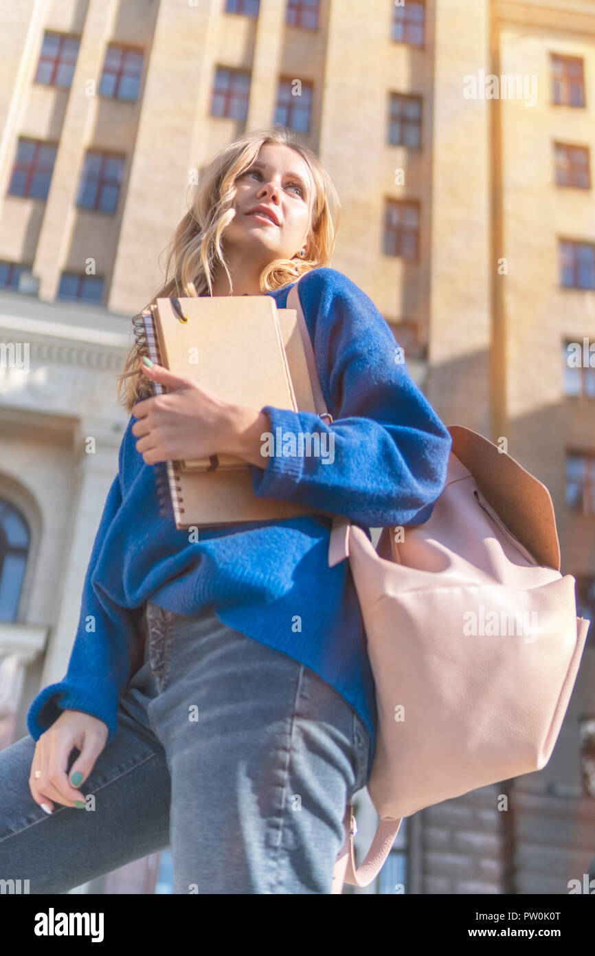 Student with notebooks at the university Stock Photo - Alamy