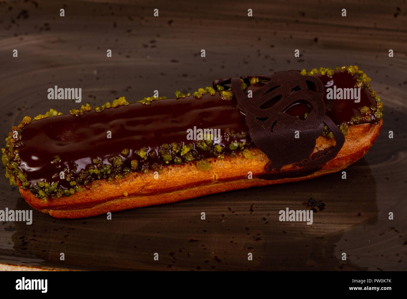 Tasty sweet Eclair with cream Stock Photo - Alamy