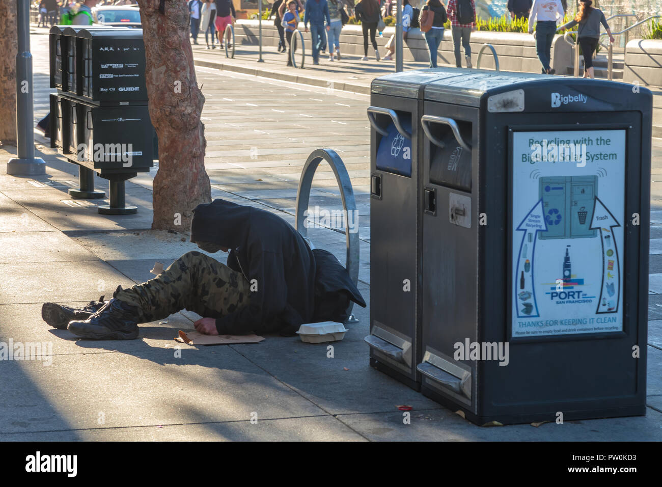 Homeless man sleep on the sidewalk at Pier 39, San Francisco ...