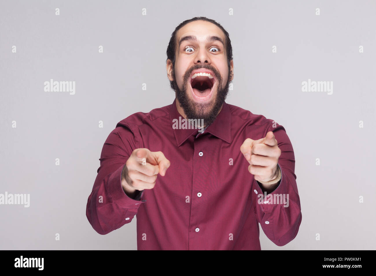 Are you serious? Portrait of handsome man with dark hair and beard in ...