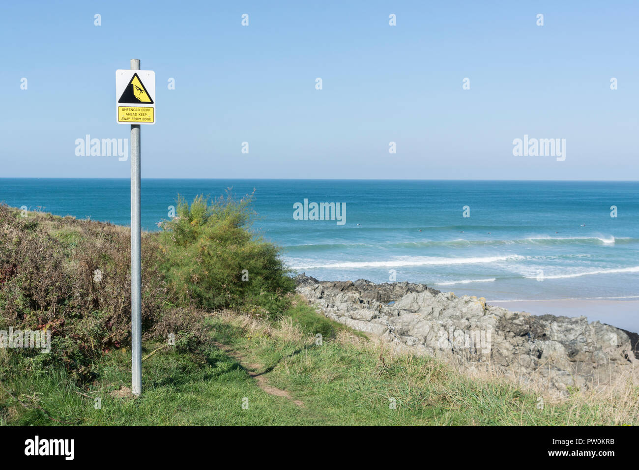 Cliff danger warning sign - with man falling over cliff, cliff edge ...