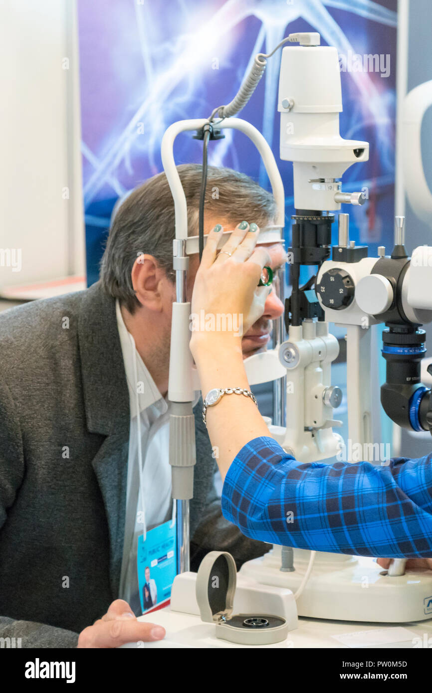 Patient eye doctor checkup patient eyes with apparatus. health care ...