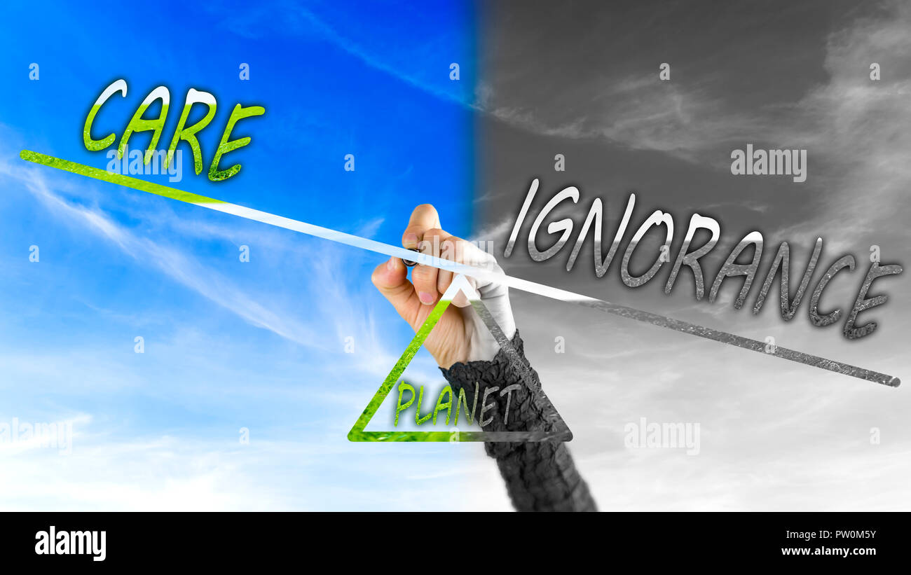 Care versus ignorance on a scale over our planet Stock Photo - Alamy