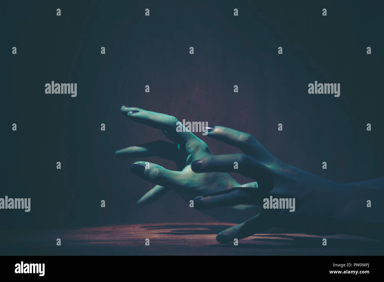 White witch hands black nails hi-res stock photography and images - Alamy