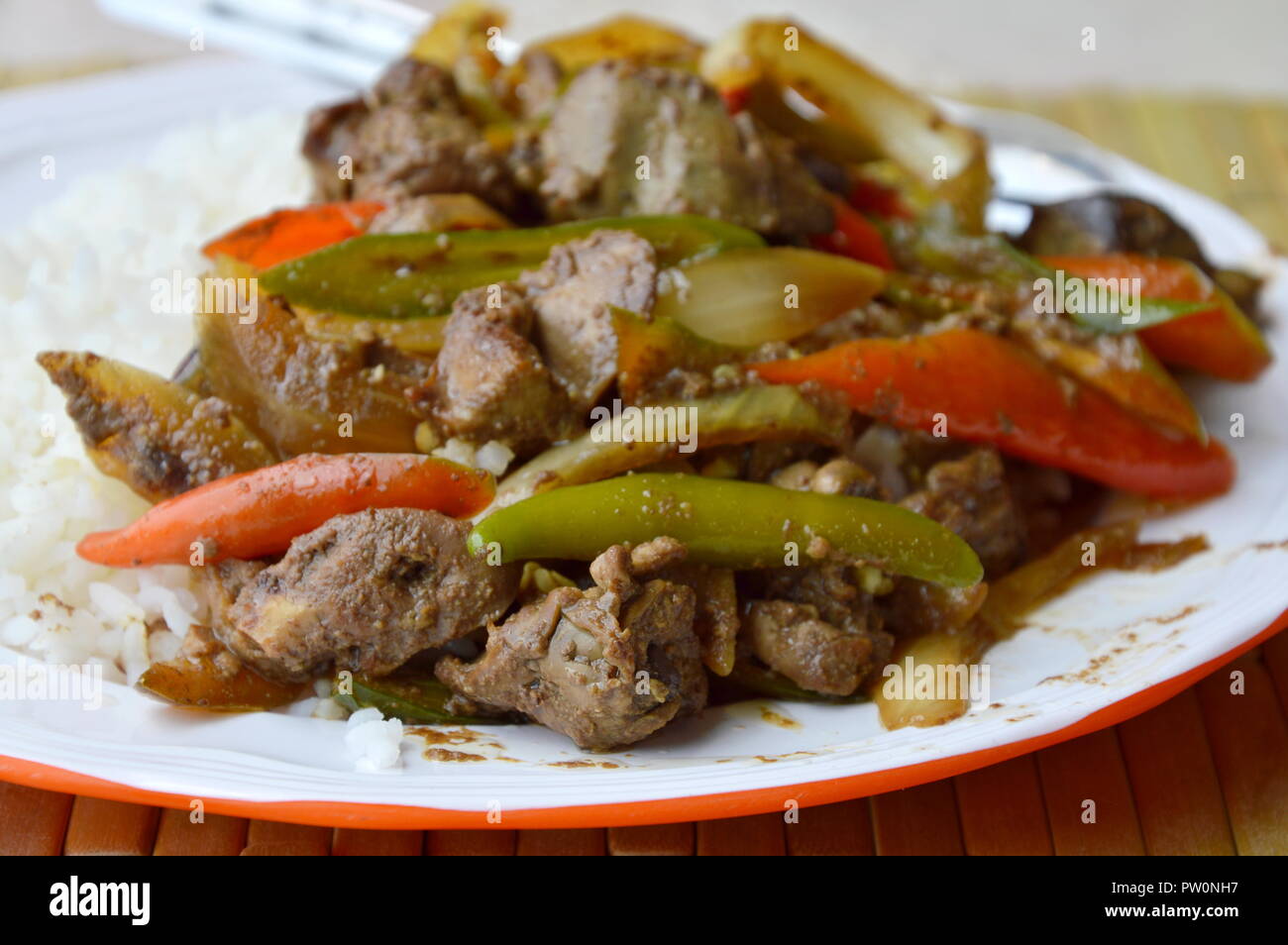spicy stir-fried chicken entrails with long sweet chili on rice Stock ...