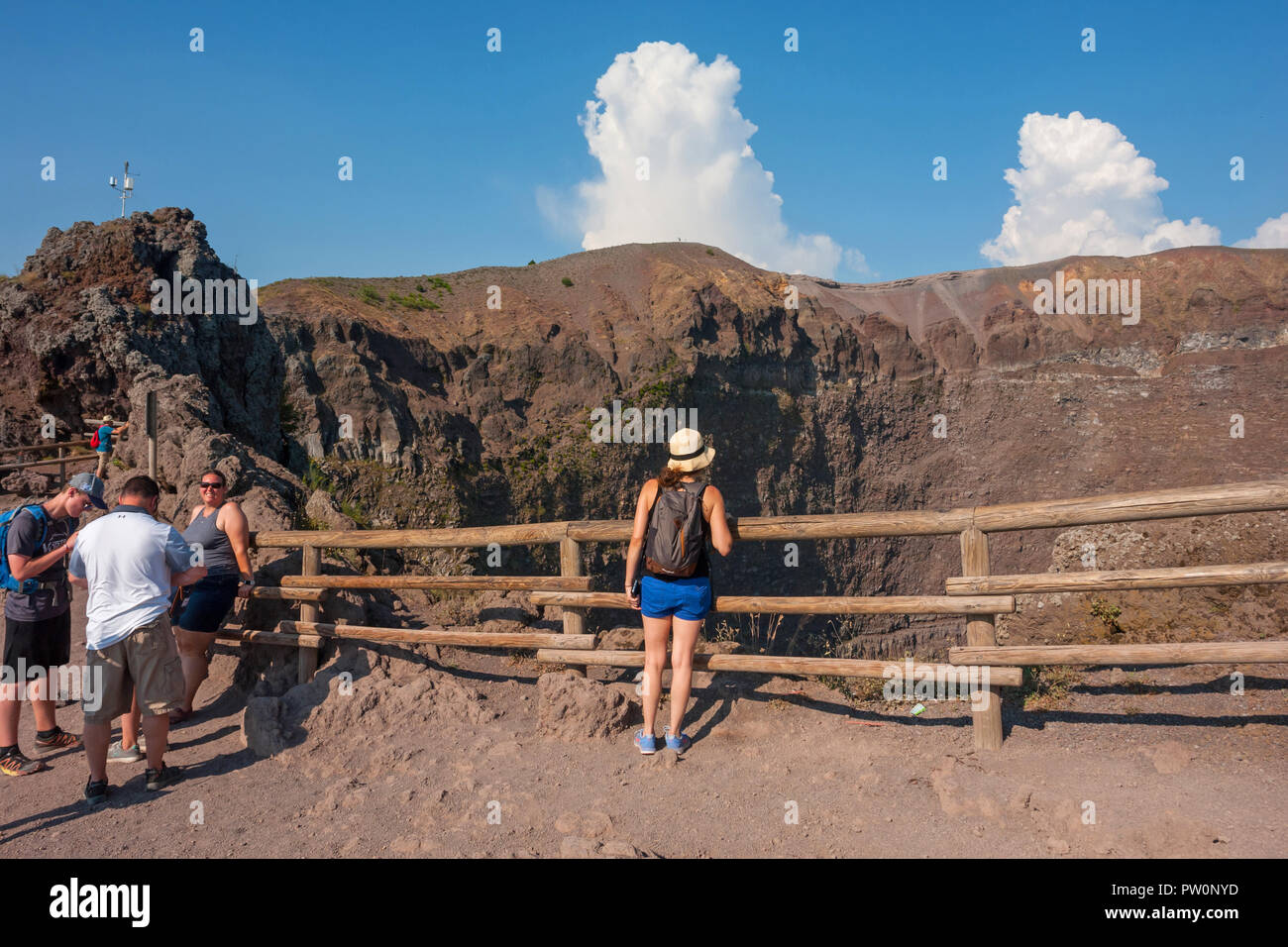 MOUNT VESUVIUS, ITALY - AUGUST 1, 2018: Tourists walk around the crater ...