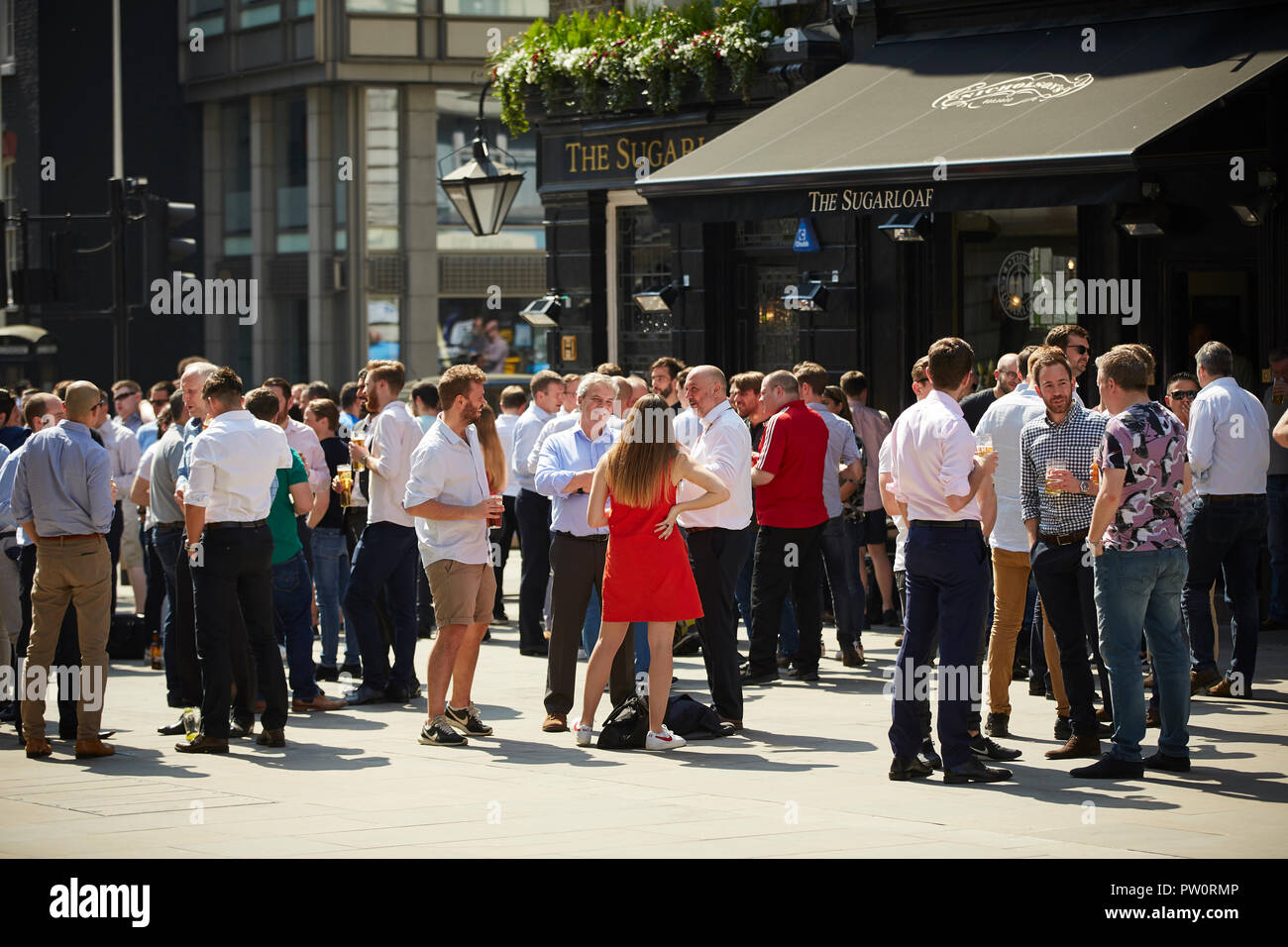 Busy London pavement outside pub Stock Photo - Alamy