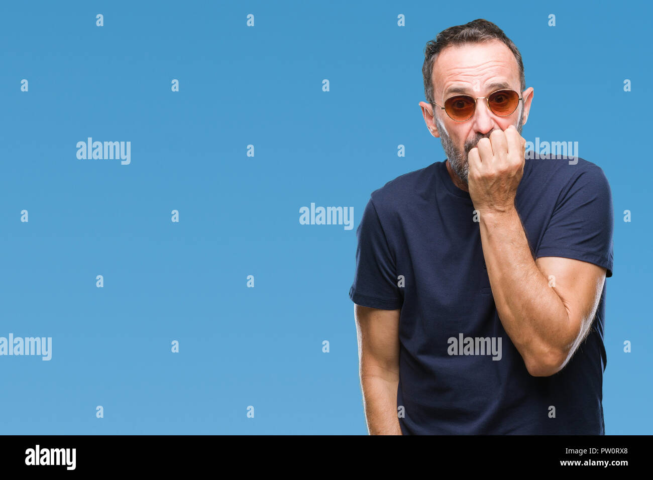 Middle age hoary senior man wearing sunglasses over isolated background ...