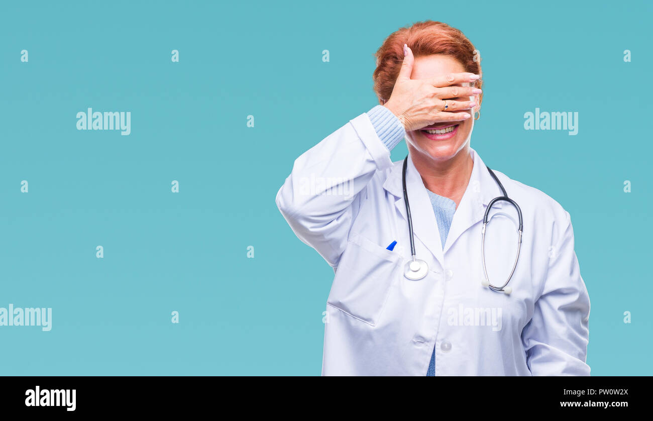 Senior caucasian doctor woman wearing medical uniform over isolated ...
