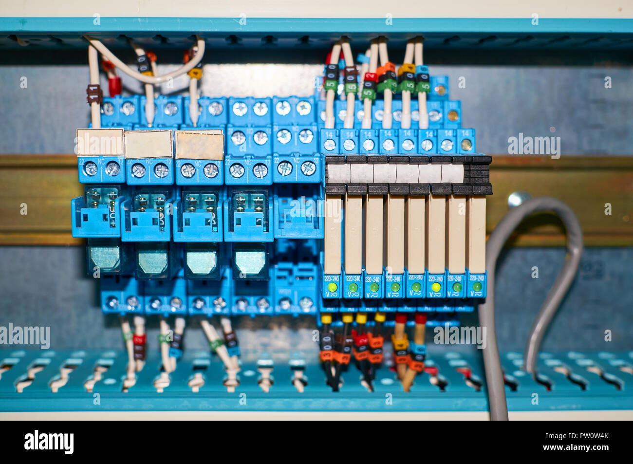 Relay with connected numbered colored wires. Industrial background ...