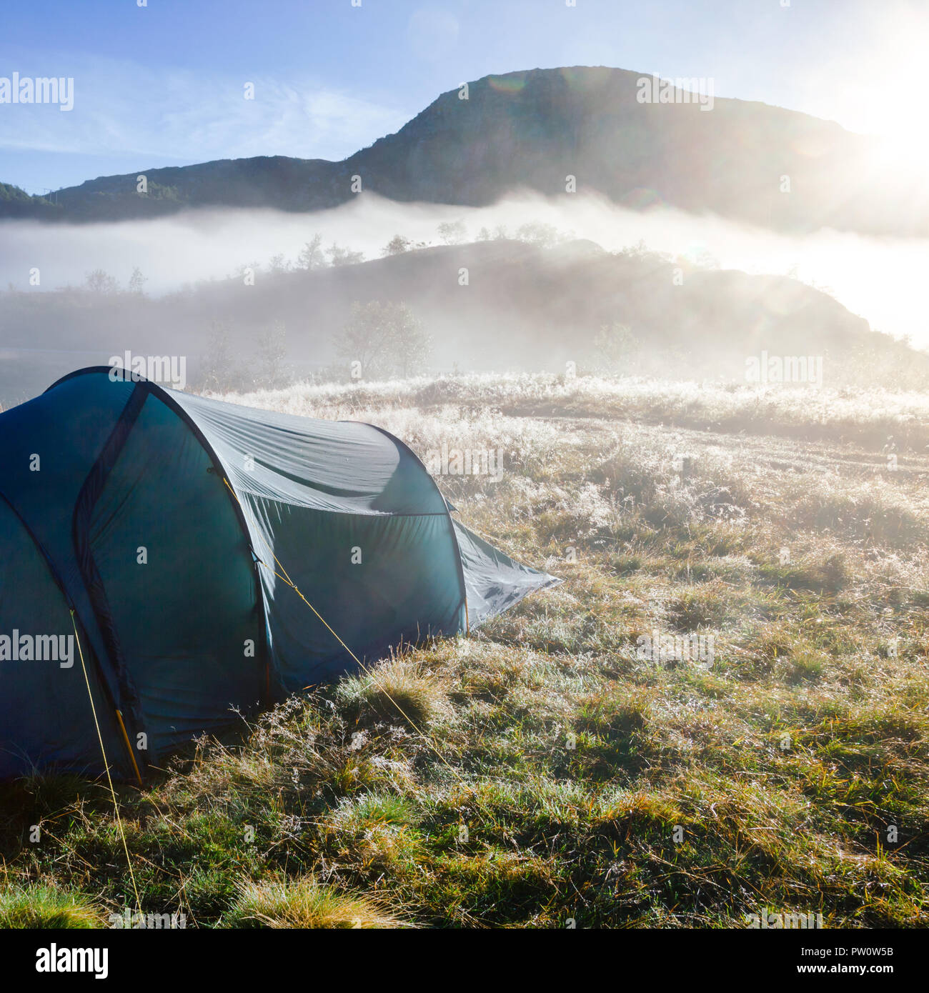 Camping tent at a wild campsite in norwegian mountains in a morning ...