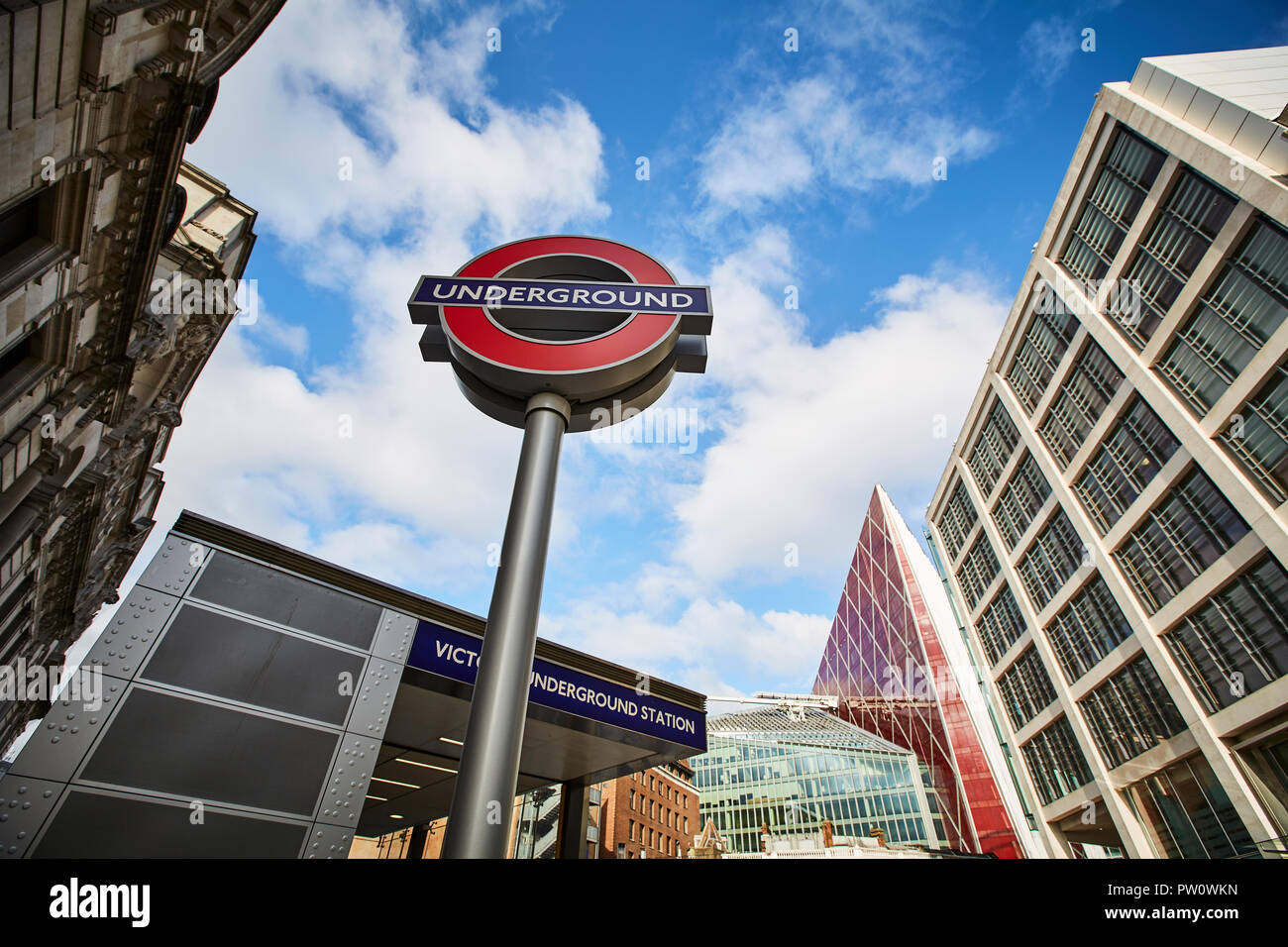 London underground sign and buildings Stock Photo - Alamy