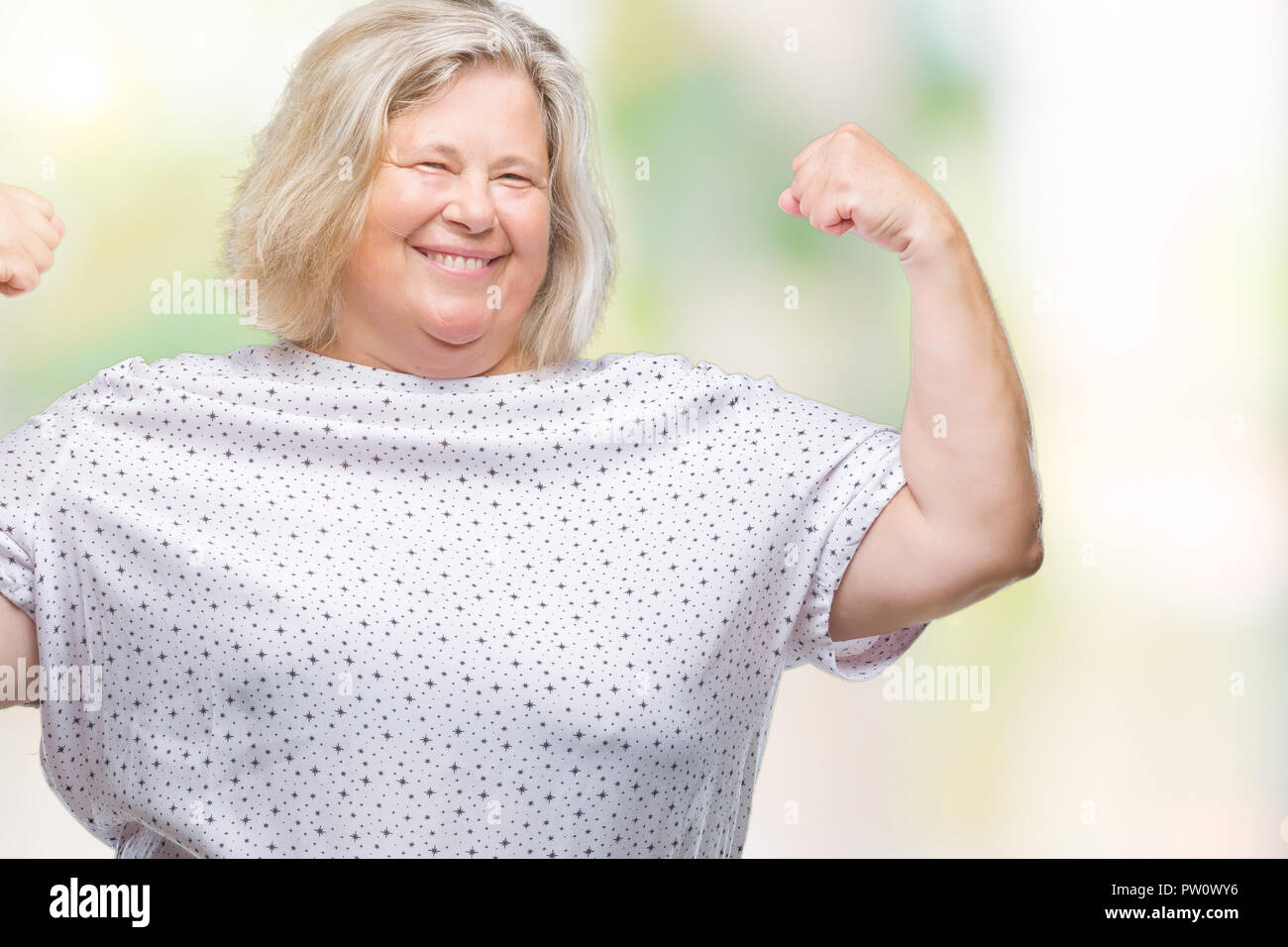 Senior plus size caucasian woman over isolated background showing arms ...