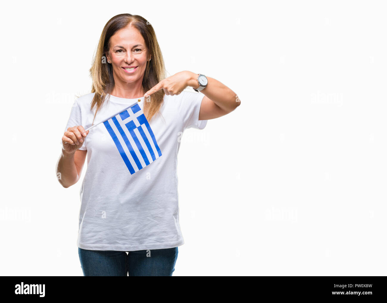 Middle age hispanic woman holding flag of Greece over isolated ...