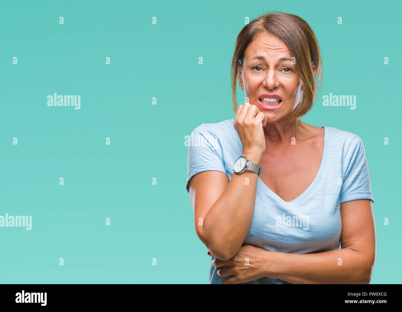 Middle age senior hispanic woman over isolated background looking ...