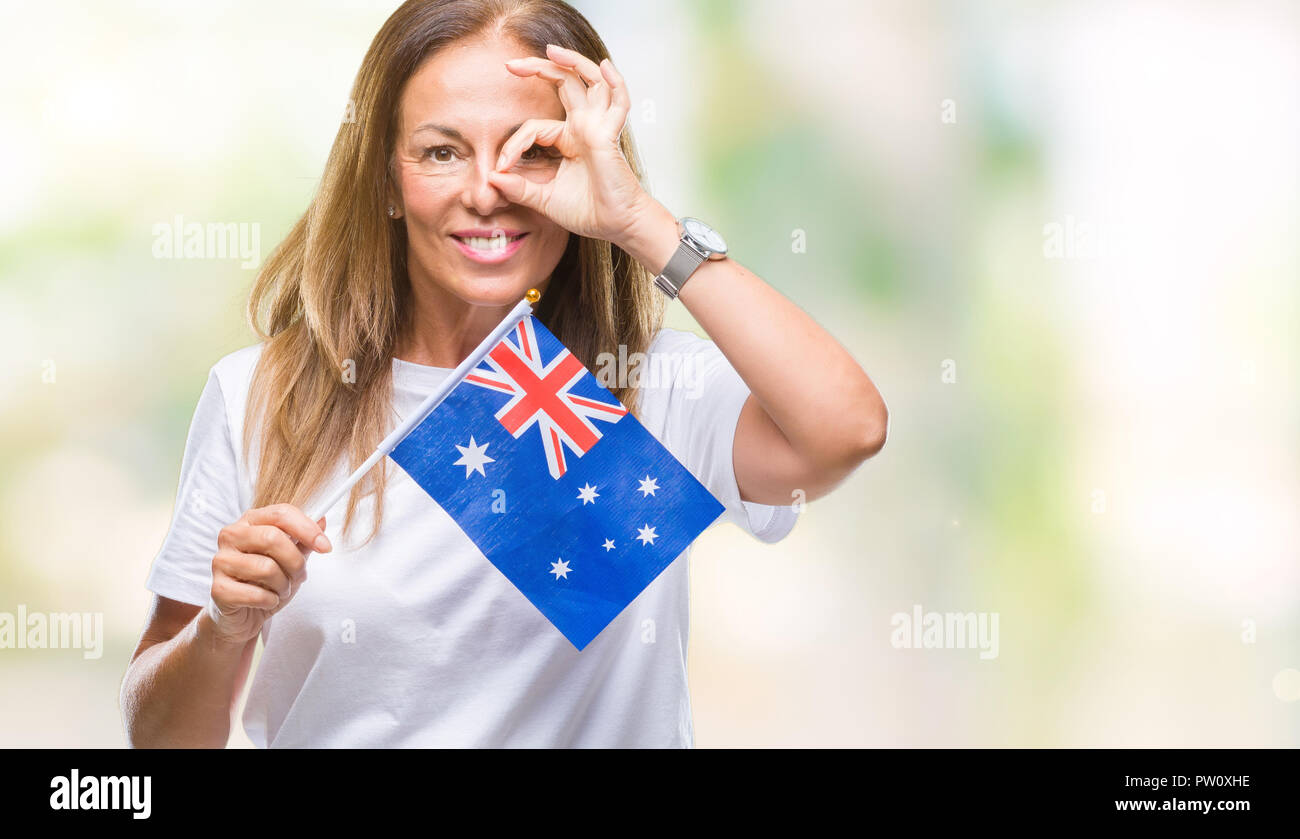 Middle age hispanic woman holding flag of Australia over isolated ...