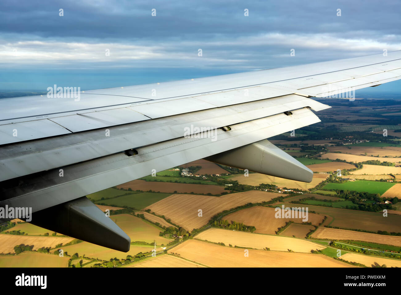 Airplane wing before landing Stock Photo - Alamy