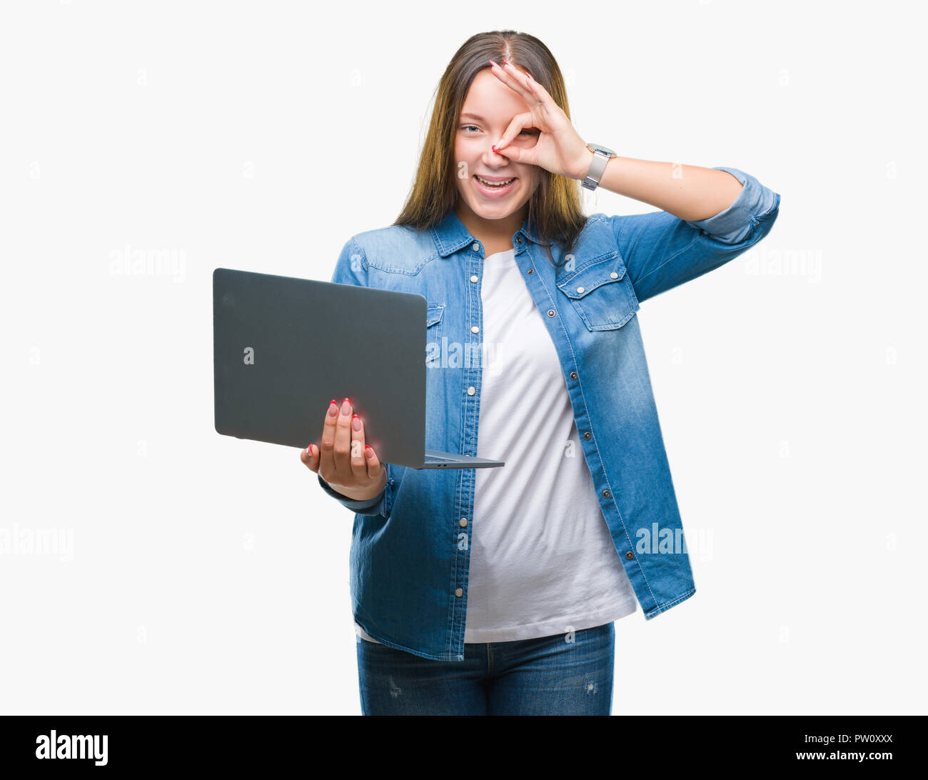 Young caucasian woman using laptop over isolated background with happy ...
