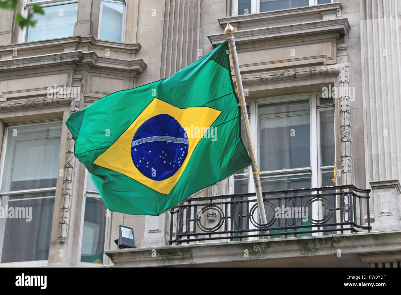 National Brazil Flag at Building Window Stock Photo - Alamy