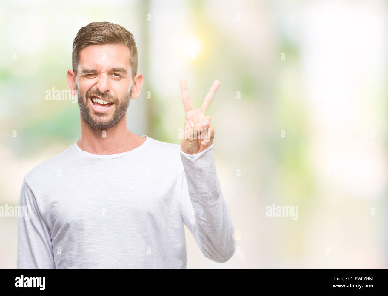 Young handsome man over isolated background smiling with happy face ...