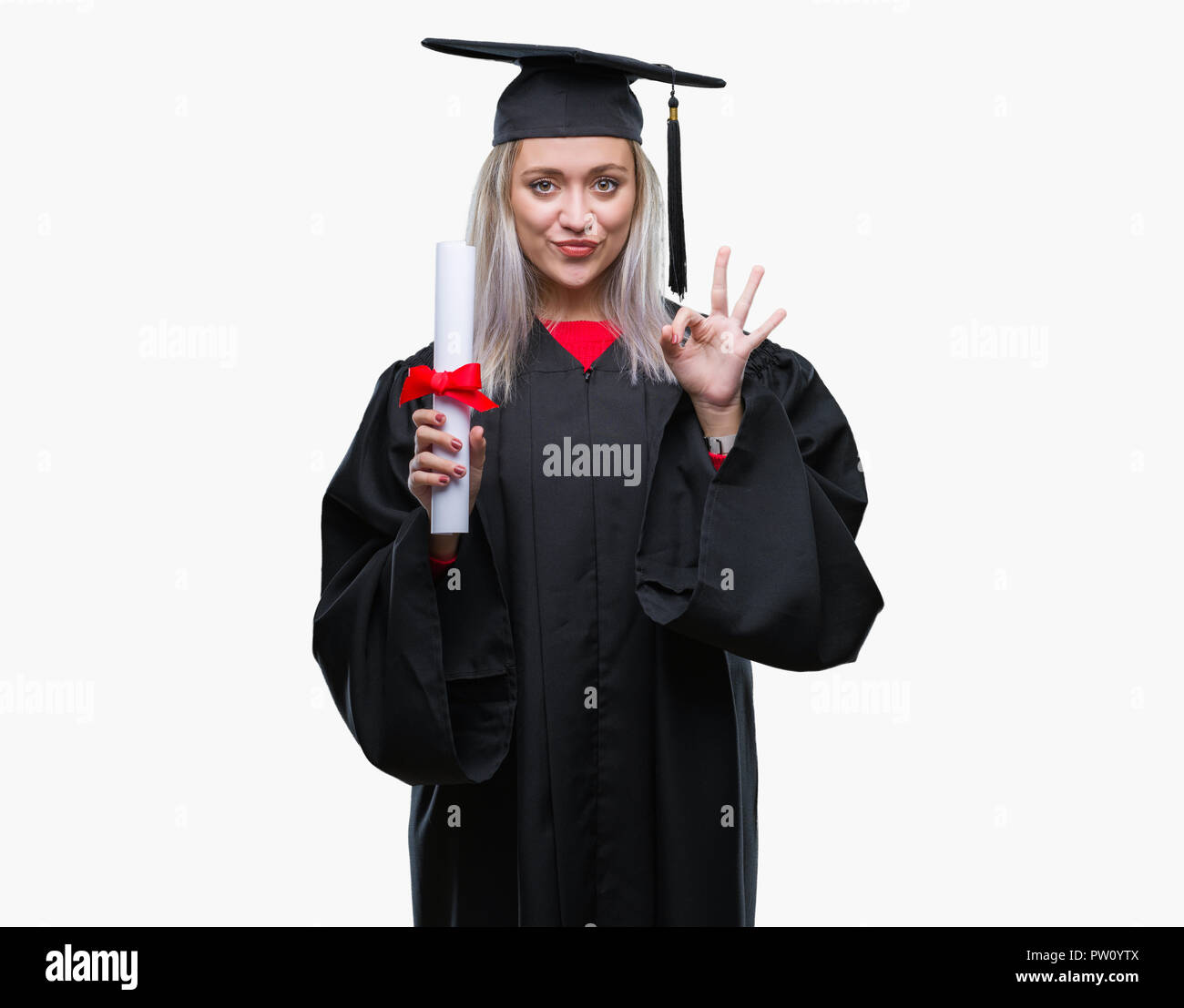 Young blonde woman wearing graduate uniform holding degree over ...