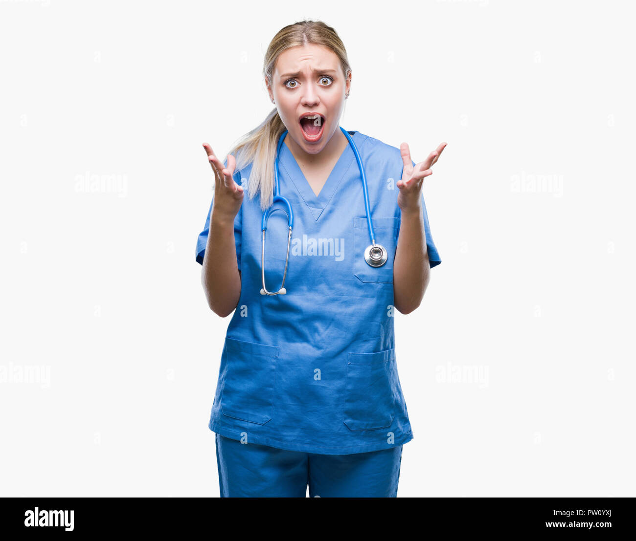 Young blonde surgeon doctor woman over isolated background celebrating ...