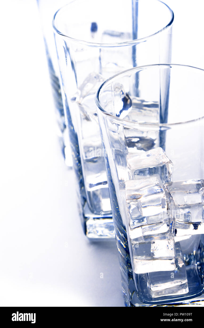 three glasses with ice cubes closeup on white background Stock Photo ...