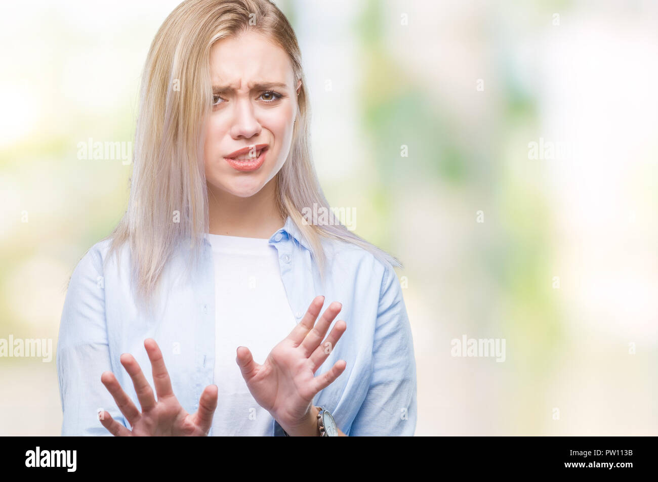 Young blonde woman over isolated background disgusted expression ...