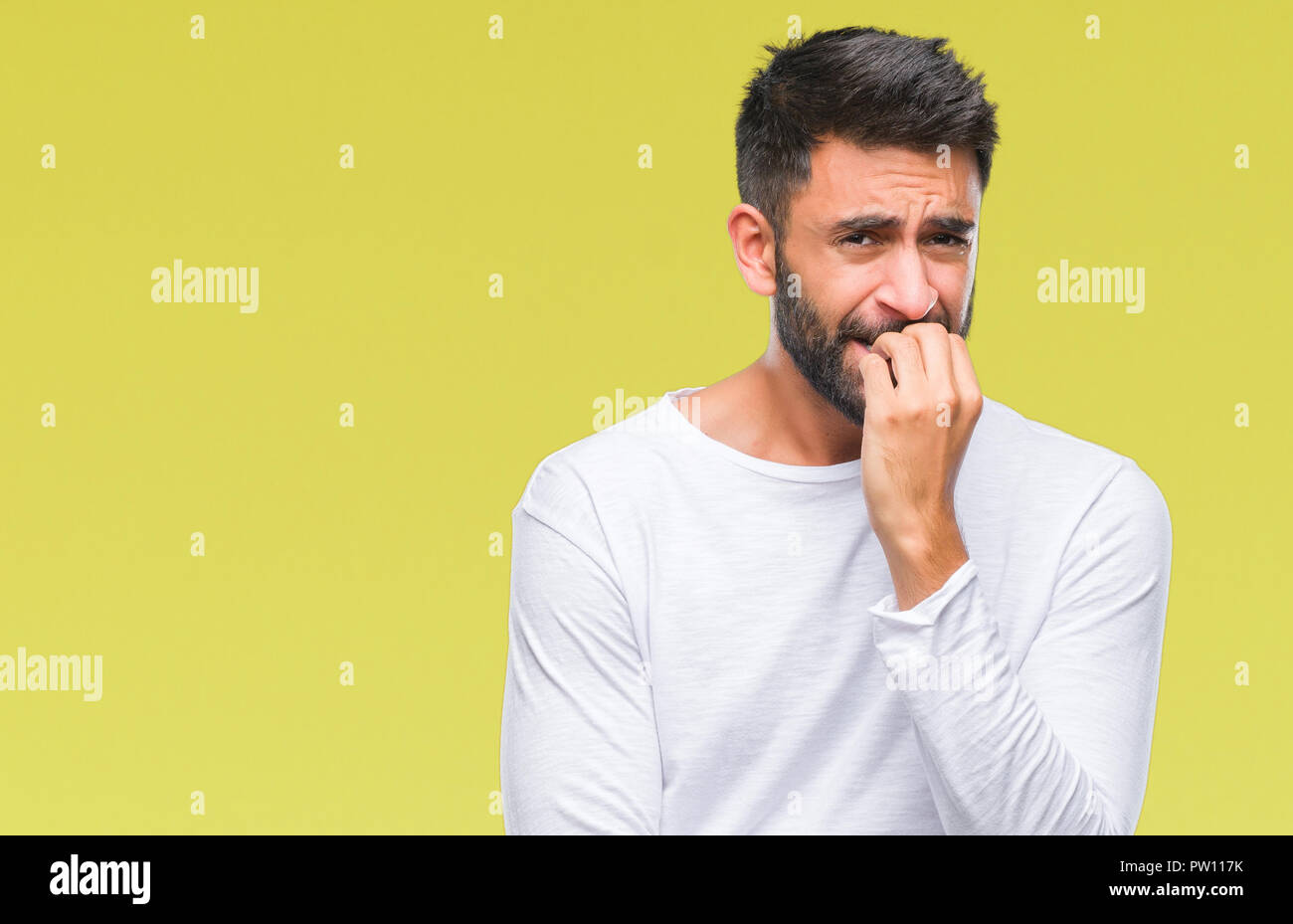 Adult hispanic man over isolated background looking stressed and ...